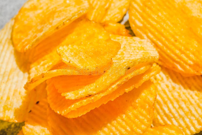 Background of Potato Crisps Close-up. the Texture of the Corrugated ...