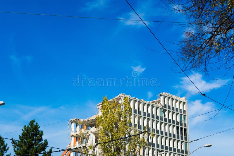 Background of Process of Demolition of Building. Excavator Breaking Old ...