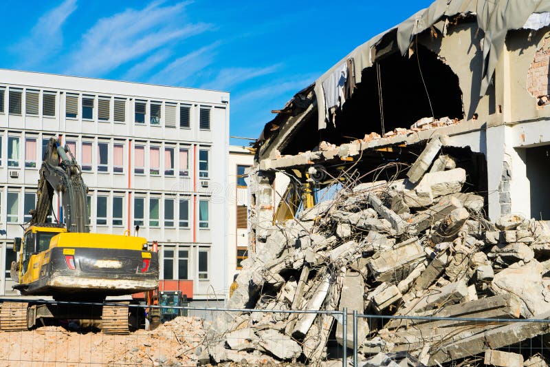 Background of Process of Demolition of Building. Excavator Breaking Old ...
