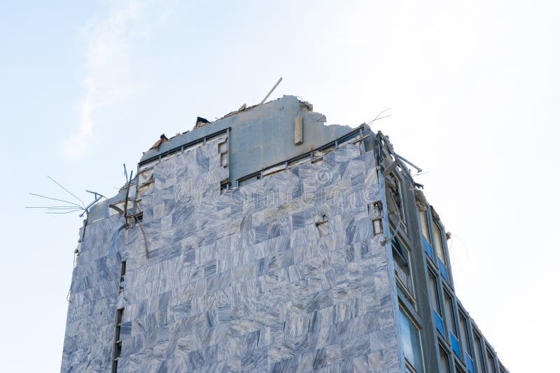 Background of Process of Demolition of Building. Excavator Breaking Old ...