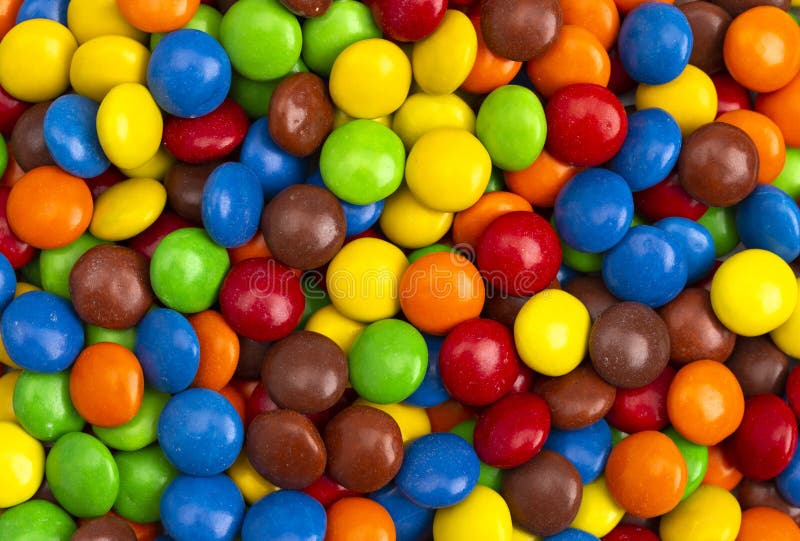 Background of Rainbow Colored Candy Coated Chocolate Buttons Stock ...