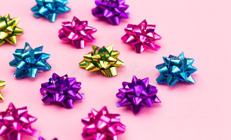 Background of Rainbow Colored Gift Bows on a Pick Surface Stock Image ...