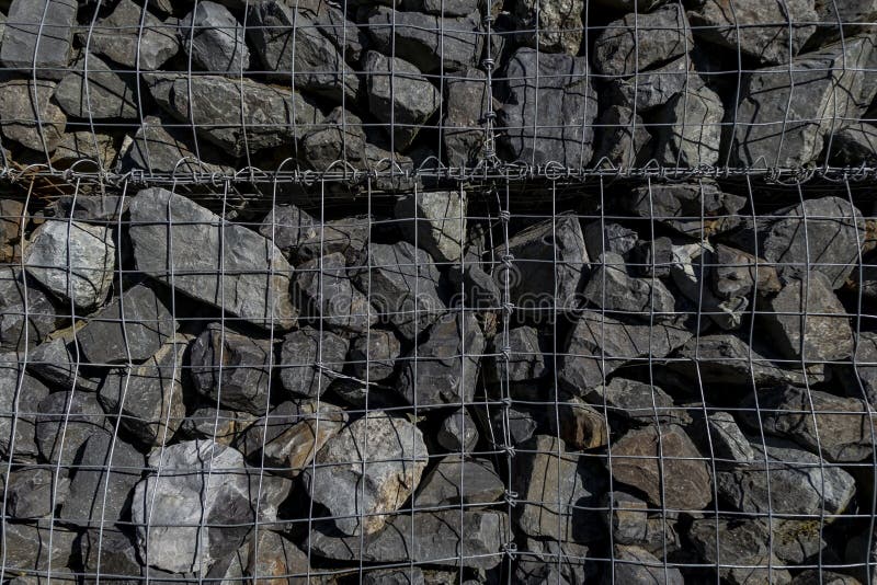 Background-rocks Supported by Wire Stock Image - Image of color, stones ...