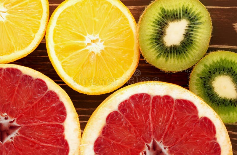 Background of Round Citrus Fruits, Orange, Grapefruit and Kiwi Stock ...