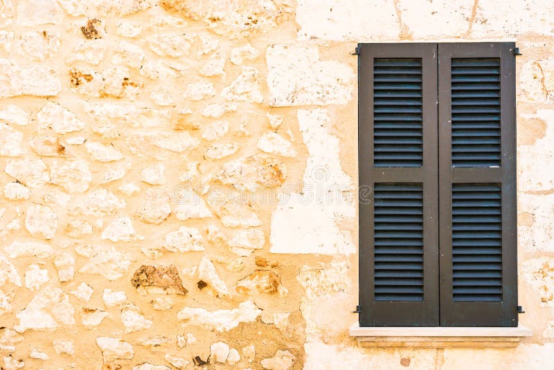 Rustic Stone Wall with Closed Window Shutter, Detail View Stock Image ...