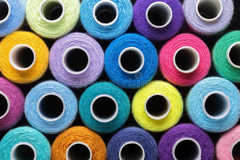 Background of Sewing Threads in Different Colors Pink, Blue, Green and ...