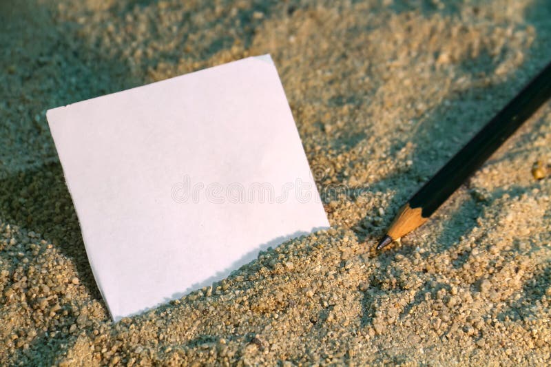 Background of Shells in the Sand with a Piece of Paper and a Pencil ...