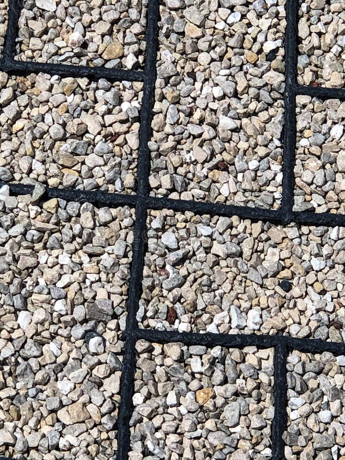 Background of Small Pebbles with Black Plastic Borders Stock Photo ...