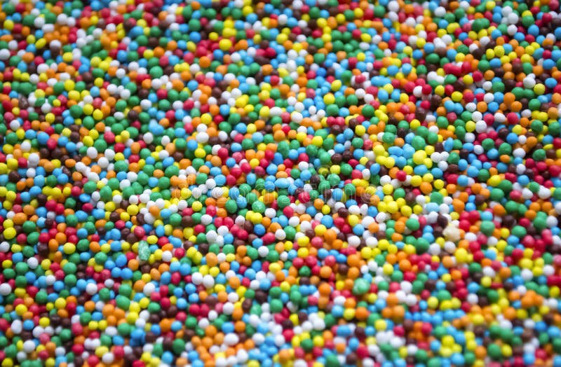 The Background is Small Sugar Candies Multicolor. Colored Easter Powder ...