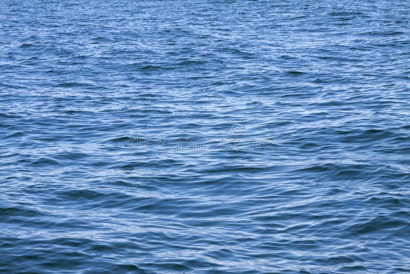 Background, Small Waves of the Sea, and Above Them the Blue Sky Stock ...