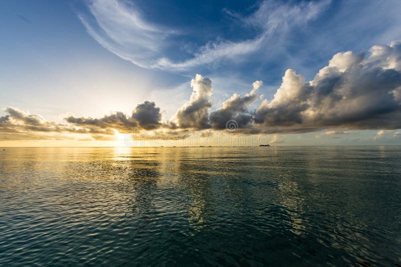 Background of Smooth Waves at the Sea with Cloudscape Stock Photo ...