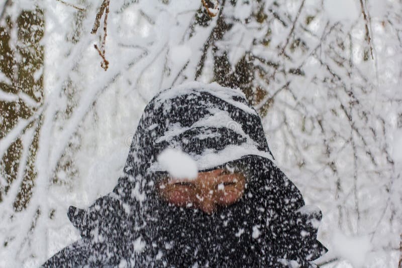 Background, Snow from a Tree Branch Strewn on a Man`s Head in a Warm ...