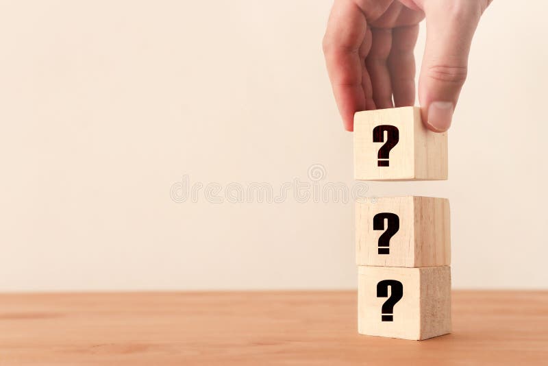Background of a Stack of Wooden Blocks with a Question Mark Symbol on a ...