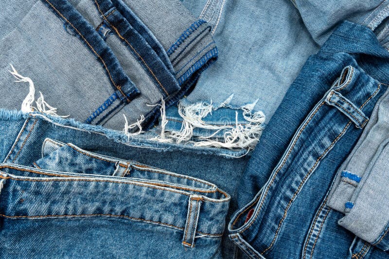 Background of Stacked Jeans. Texture of Scattered Jeans Stock Photo ...