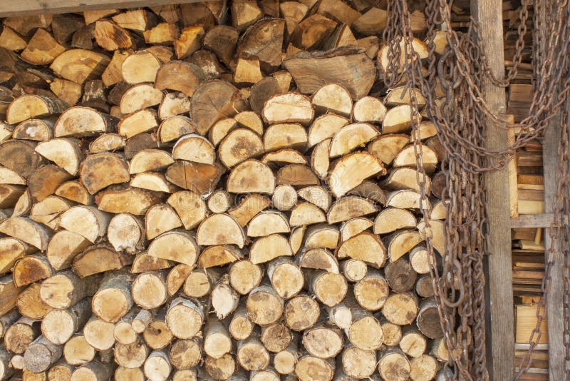 Firewood of Various Shapes Stacked in Pyramid on Veranda Stock Photo ...