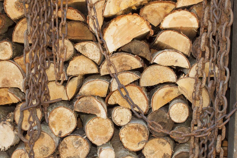 Firewood of Various Shapes Stacked in Pyramid on Veranda Stock Photo ...