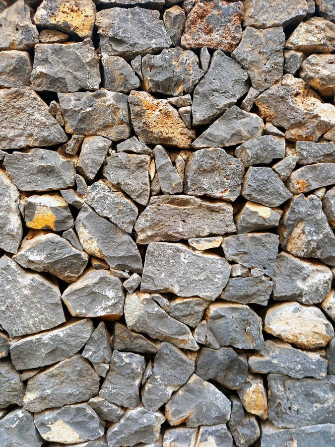 Background of Stone Wall Texture. Old Texture of Granite Stone Wall ...