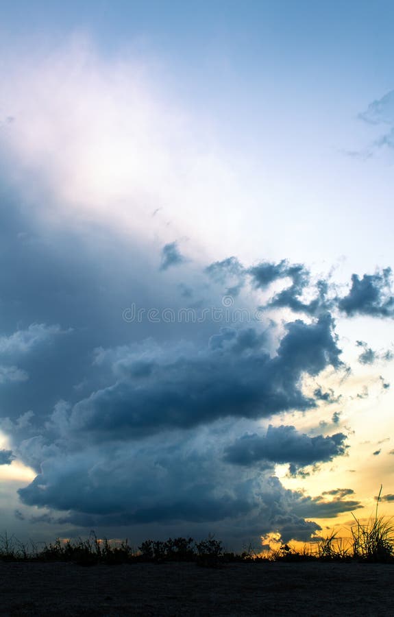 Background of Sunset on Horizon in Field, Rain Clouds Lit by the Rays ...