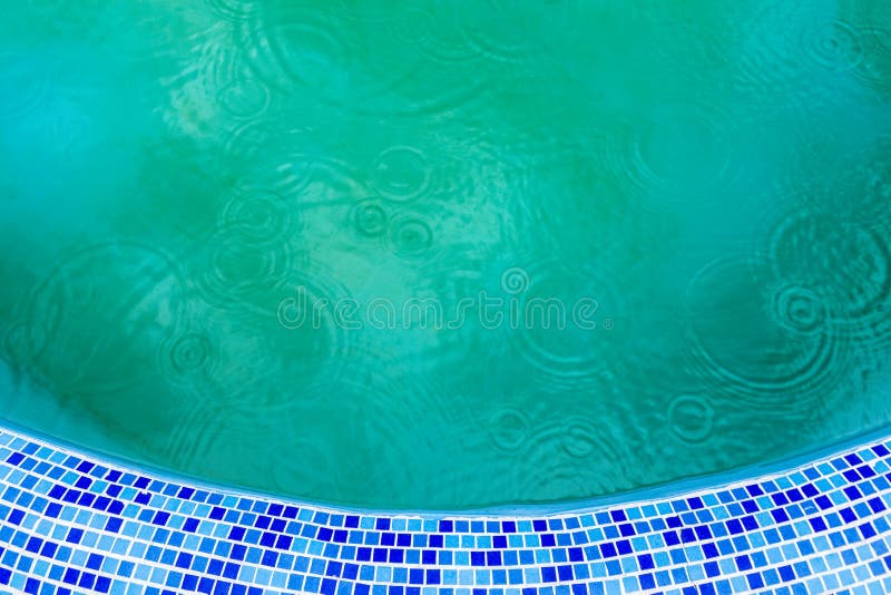 Background of Swimming Water in a Pool with Rain Drops on the Surface ...