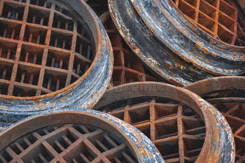 Background and Texture of Many Old Rusty Manhole Covers for Recycling ...