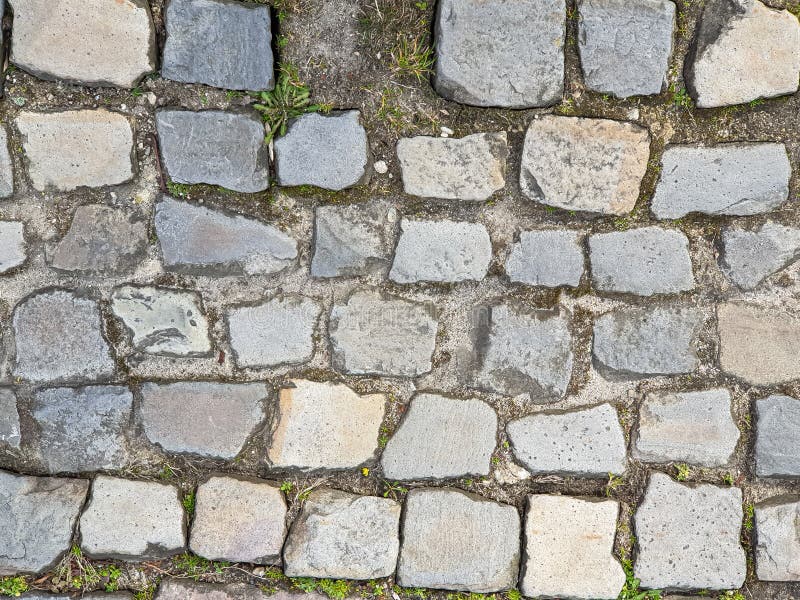 Background Texture Street With Paving Stones Or Cobblestones In The