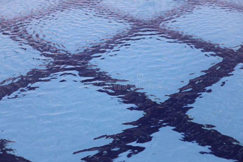 Background Texture of the Pool with Blue Stripes at the Bottom. Stock ...