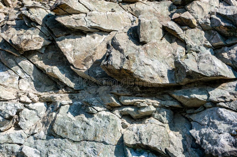 Background, Texture Rough Stones of a Stone Cliff Stock Image - Image ...