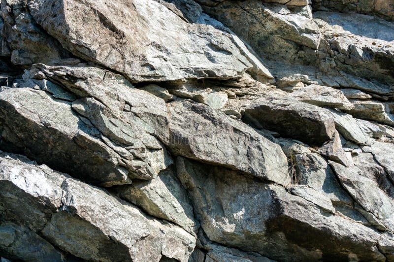 Background, Texture Rough Stones of a Stone Cliff Stock Photo - Image ...