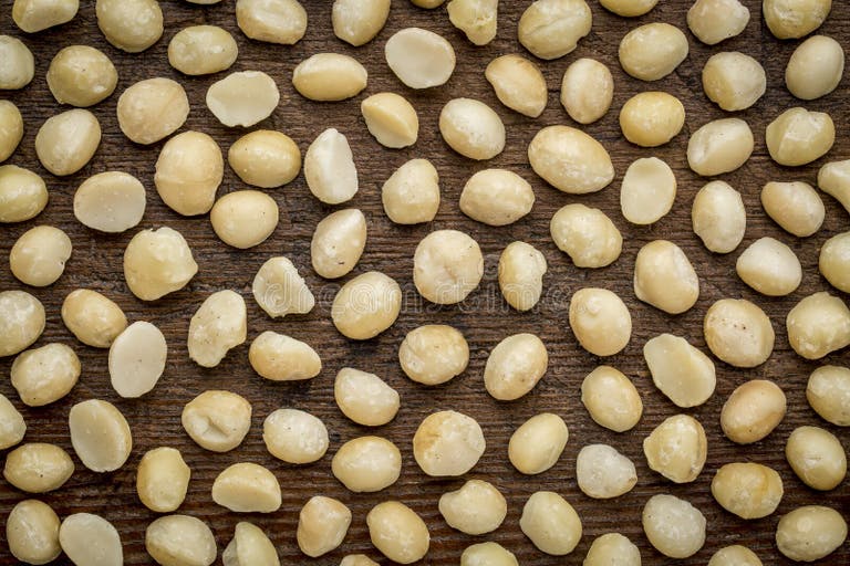 Background Texture of Shelled Macadamia Nuts on Rustic Wood - Top View ...