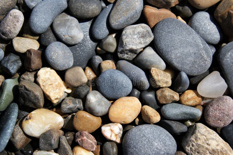 Stones of Different Sizes on the Beach. Background Texture. Stock Photo ...