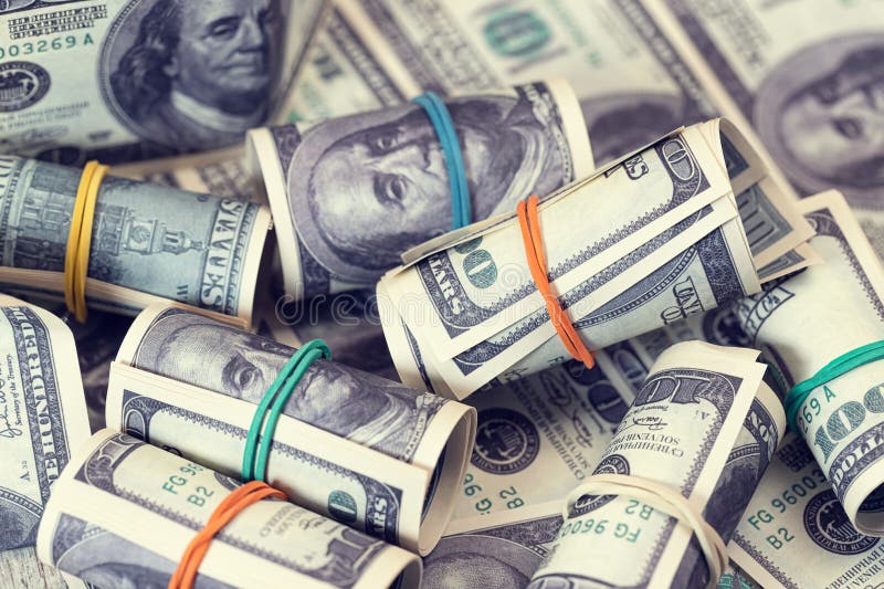 Background of Twisted Hundred Dollar Bills on the Table Stock Image ...