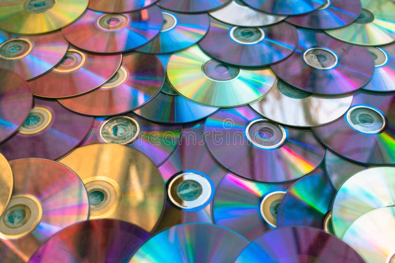 Background of CD and DVD Discs Laid Out on a Flat Surface Stock Photo ...
