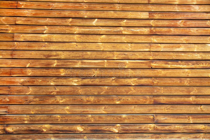The Background of the Wall is Made of Planed Wooden Boards of Brown ...