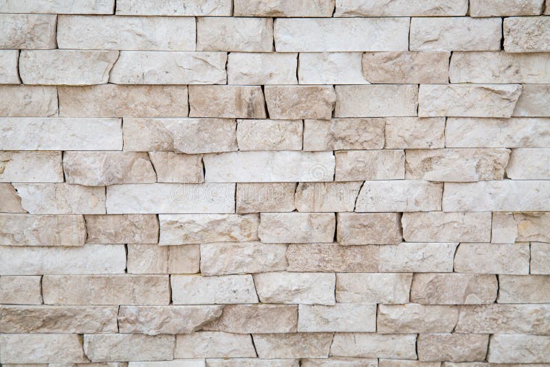 The Background of the Wall is Made of Strips of Natural Cream Marble ...