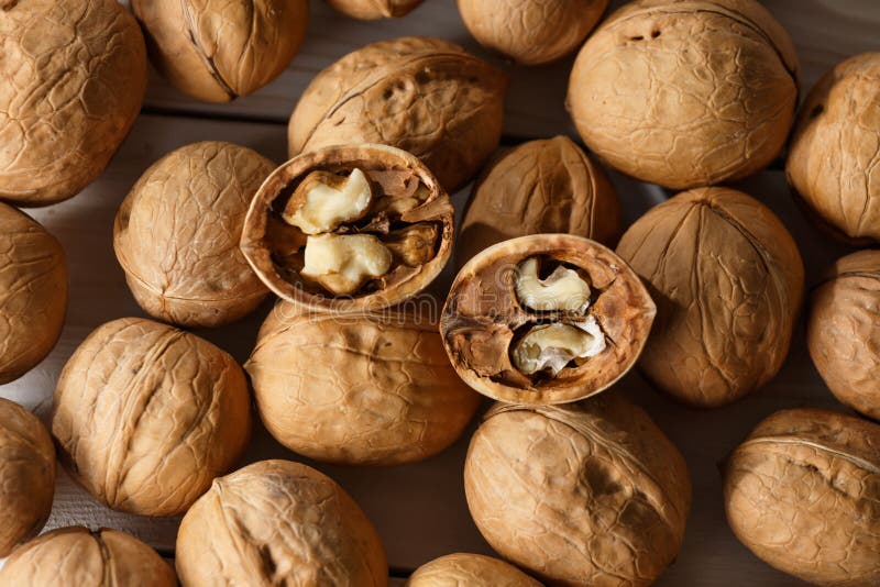 Background with Walnuts with One Open in the Middle Stock Image - Image ...