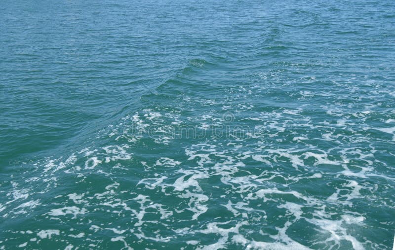 Background with Wave and Foam, Trace on the Surface of the Water Behind ...