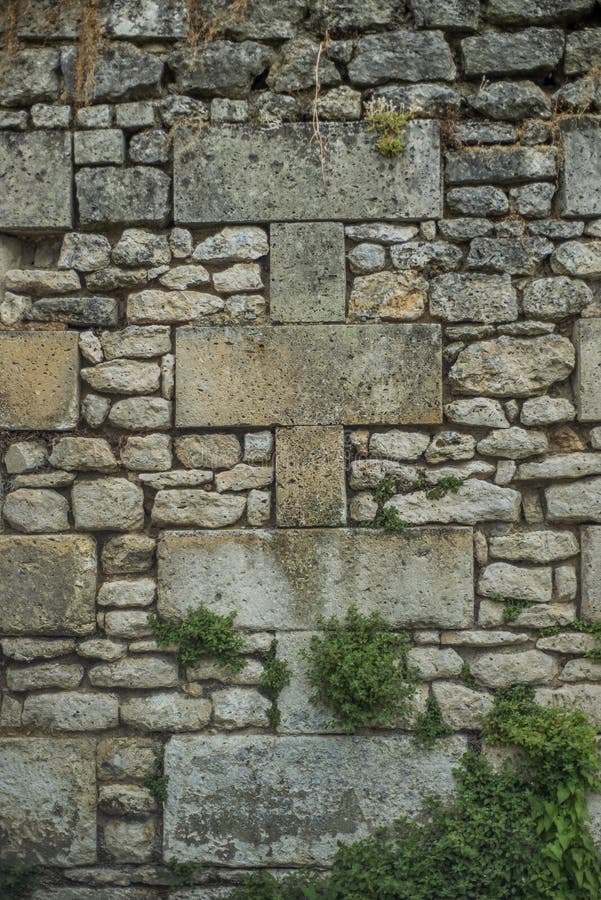 Background of a Weathered Stone Wall with Greenery Growing on it. Stock ...