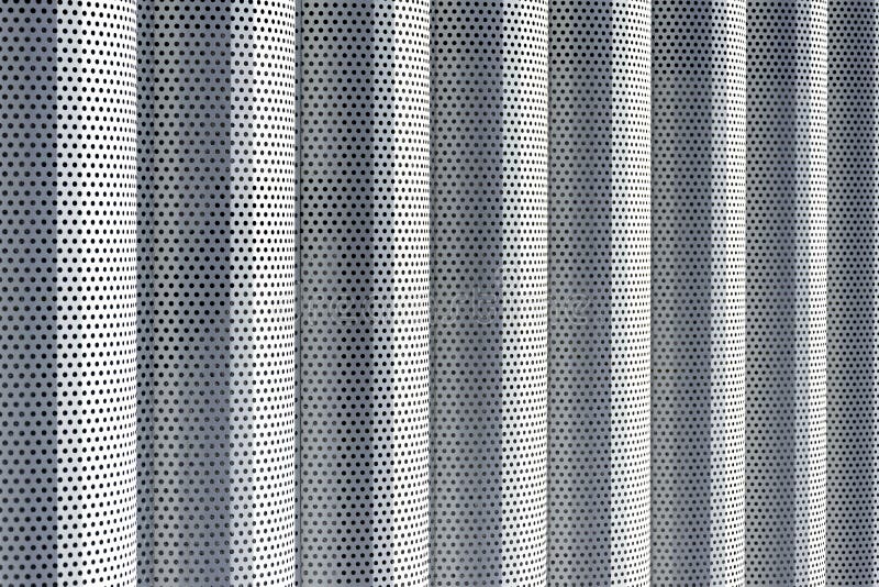 Background of White Metal Columns with Evenly Placed Holes Stock Image ...