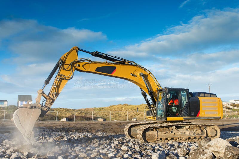 Backhoe in Action on a Construction Site Close Up Stock Photo - Image ...