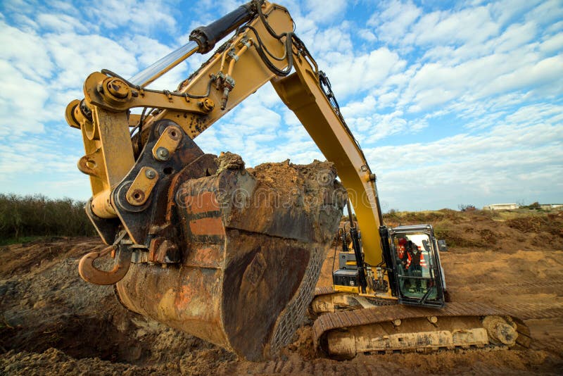 Backhoe in Action on a Construction Site Close Up Stock Photo - Image ...