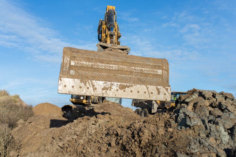 Backhoe in Action on a Construction Site Close Up Stock Image - Image ...