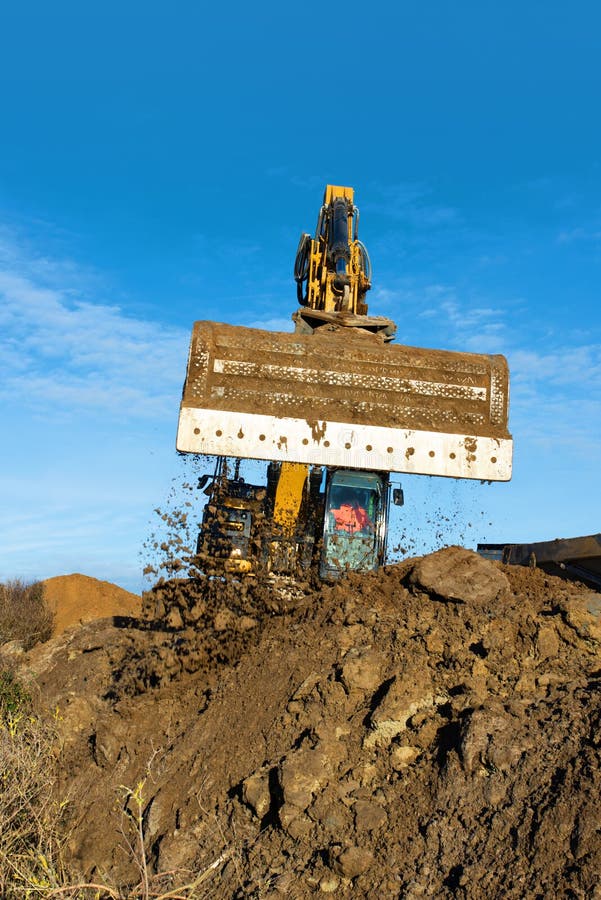 Backhoe in Action on a Construction Site Close Up Stock Photo - Image ...