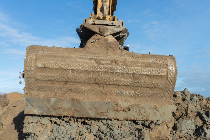Backhoe in Action on a Construction Site Close Up Stock Photo - Image ...