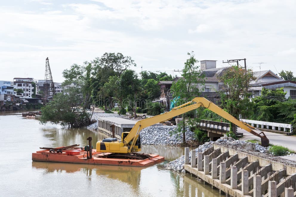 Backhoe Building the Wall for Protection Canal Stock Image - Image of ...