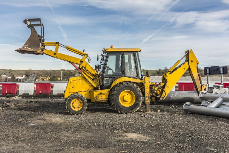Backhoe in the Construction of a Roundabout with Different Construction ...