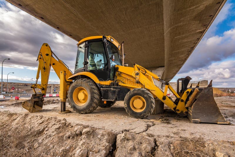 Backhoe in Construction Tasks of a Road. Preparation of the Land for ...