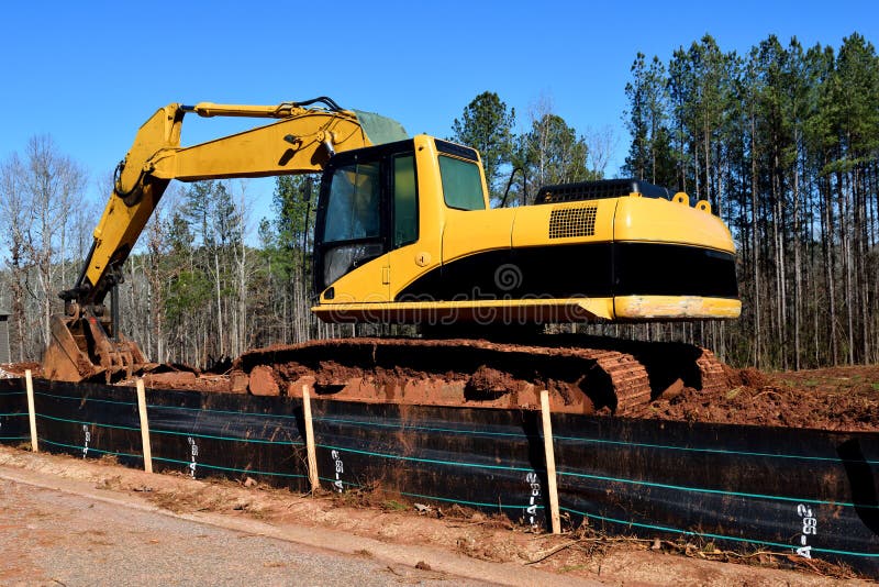 Backhoe digging up ground stock image. Image of barrier - 107818629