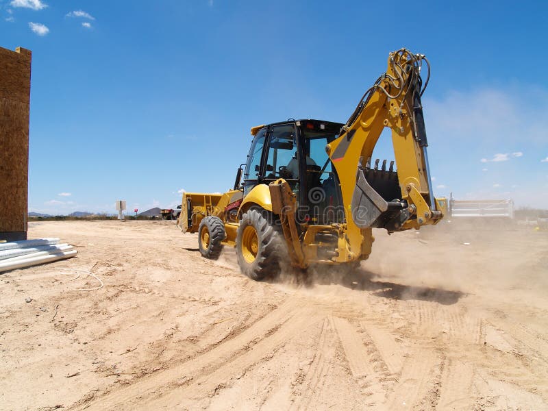 Backhoe Driving At Construction Site Stock Image - Image of earthmover ...