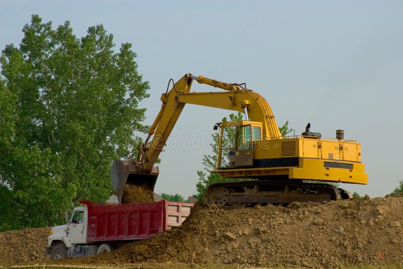 Backhoe and Dump Truck stock photo. Image of backhoe, moving - 646264