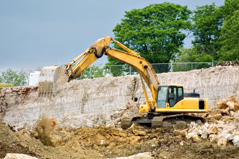 Backhoe dumping dirt stock image. Image of blue, dumping - 2625661